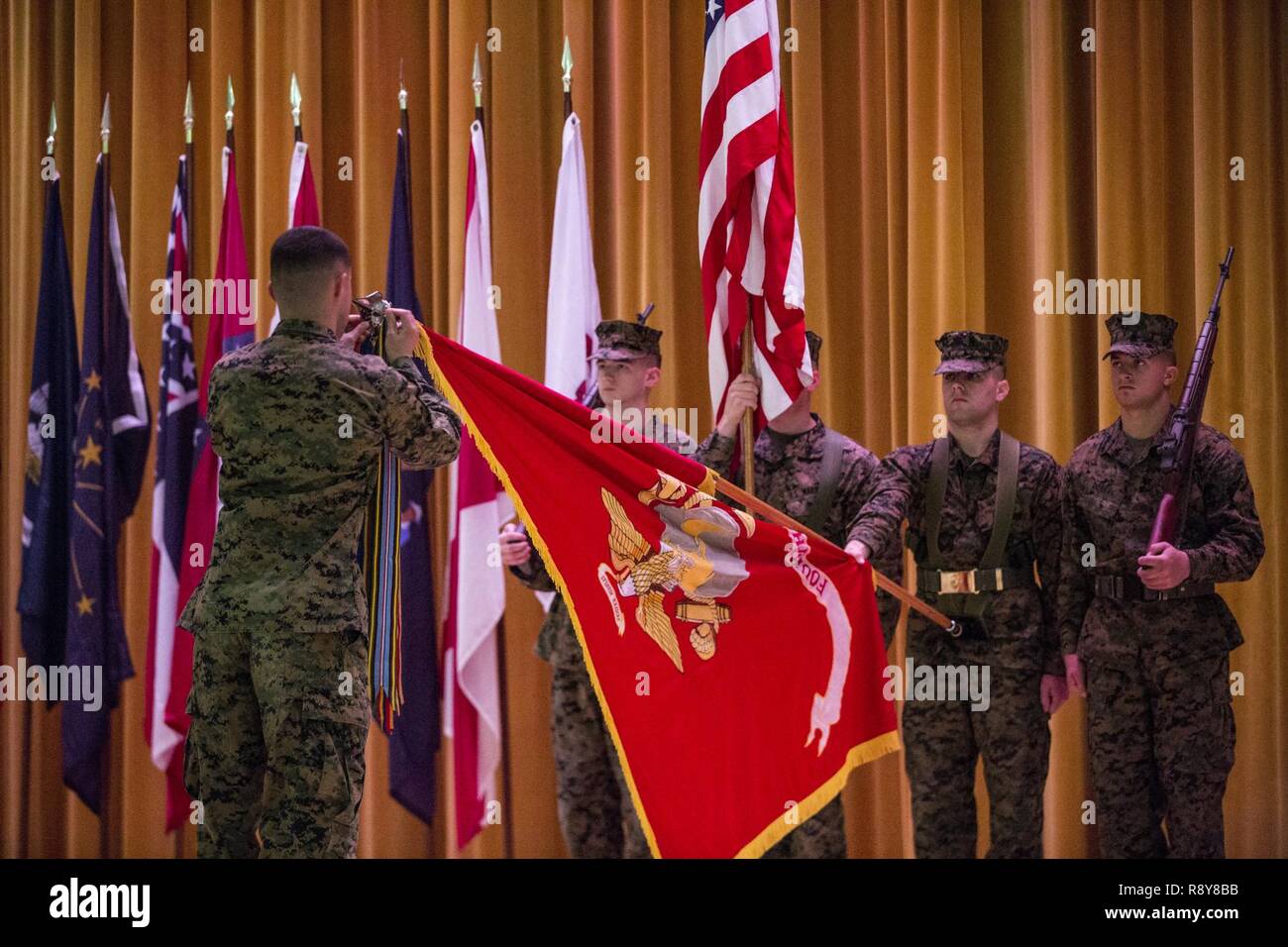 U.S. Marine with 3d Marine Division, 4th Marine Regiment attaches a ...