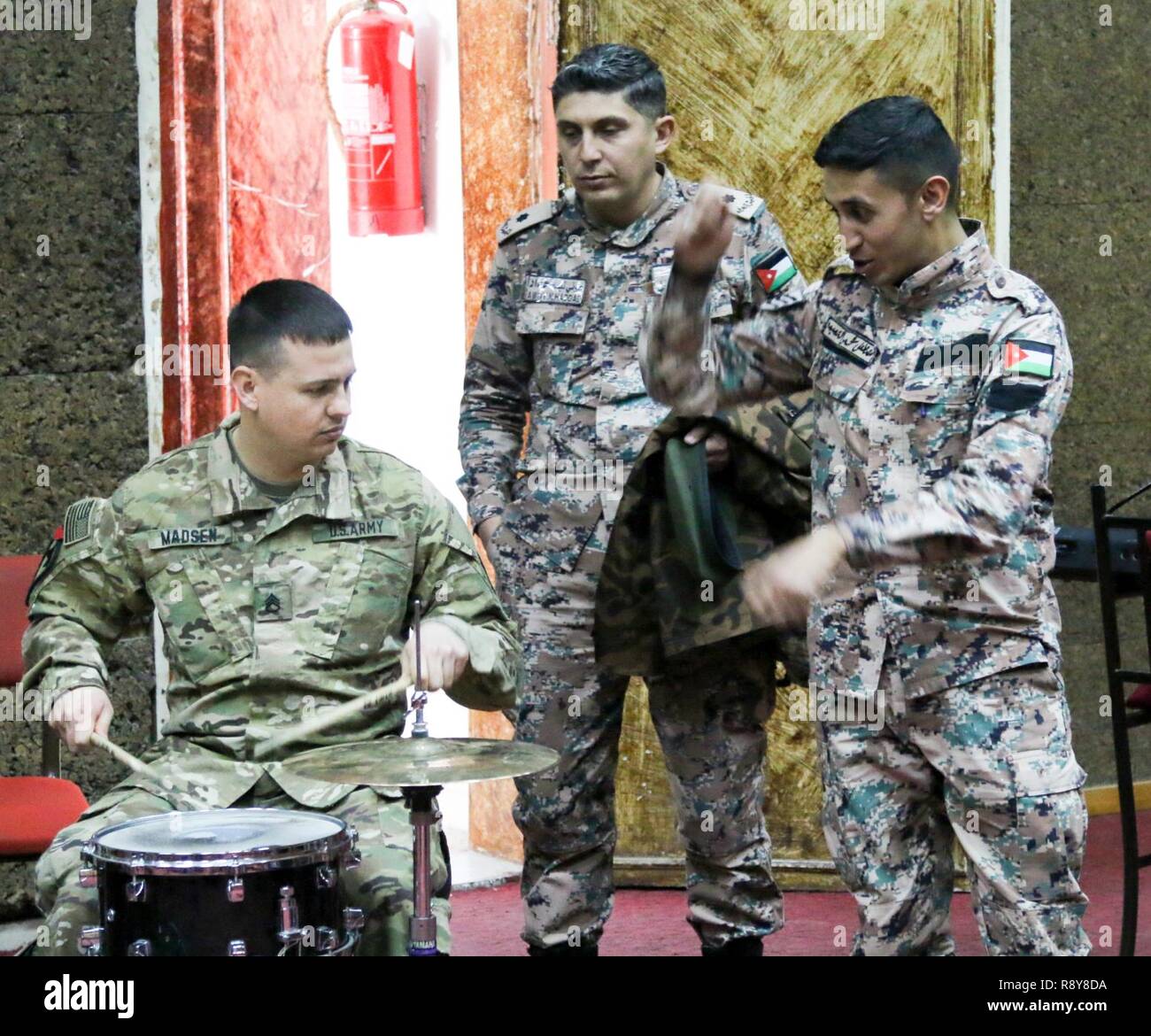 A member of the Jordan Armed Forces-Arab Army Band demonstrates how ...