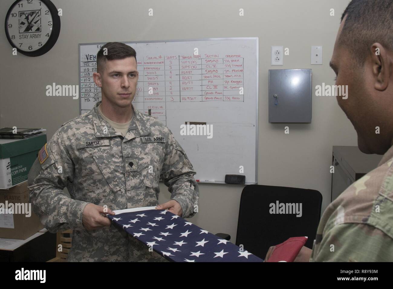 Spc. Jeffrey Smith and Sgt. Levi Kadugyed, both with Headquarters ...