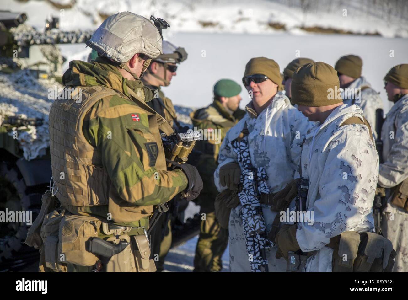 U.S. Marines with Marine Rotational Force Europe (MRF-E) interact with ...
