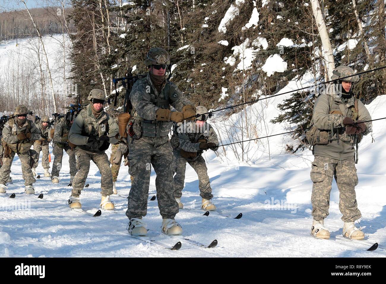 Soldiers skijour behind a Small Unit Support Vehicle as part of U.S ...