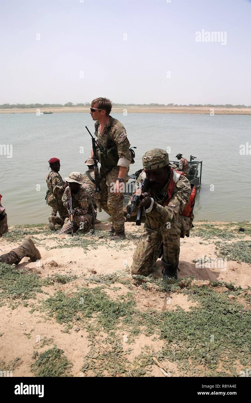 Chadian Soldiers conduct a beach infiltration training exercise as part ...