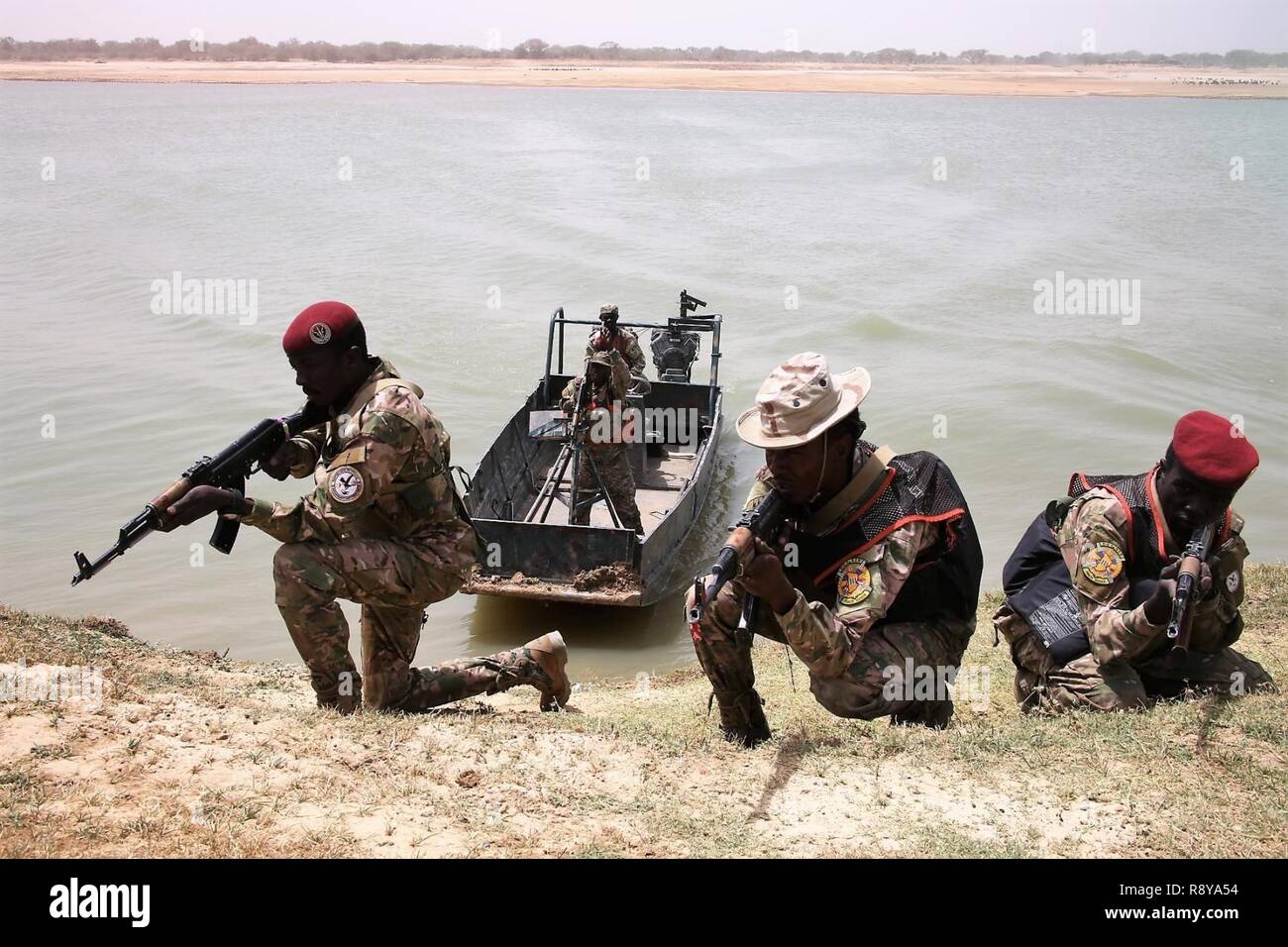 Chadian Soldiers conduct a beach infiltration training exercise as part ...