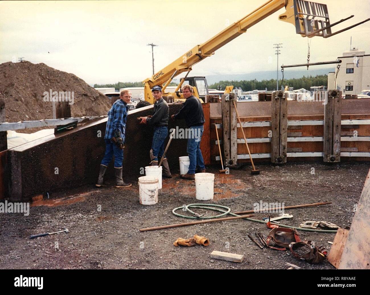 Kenneth and Donald Cutler, left to right, and Howard Goentzel work on ...