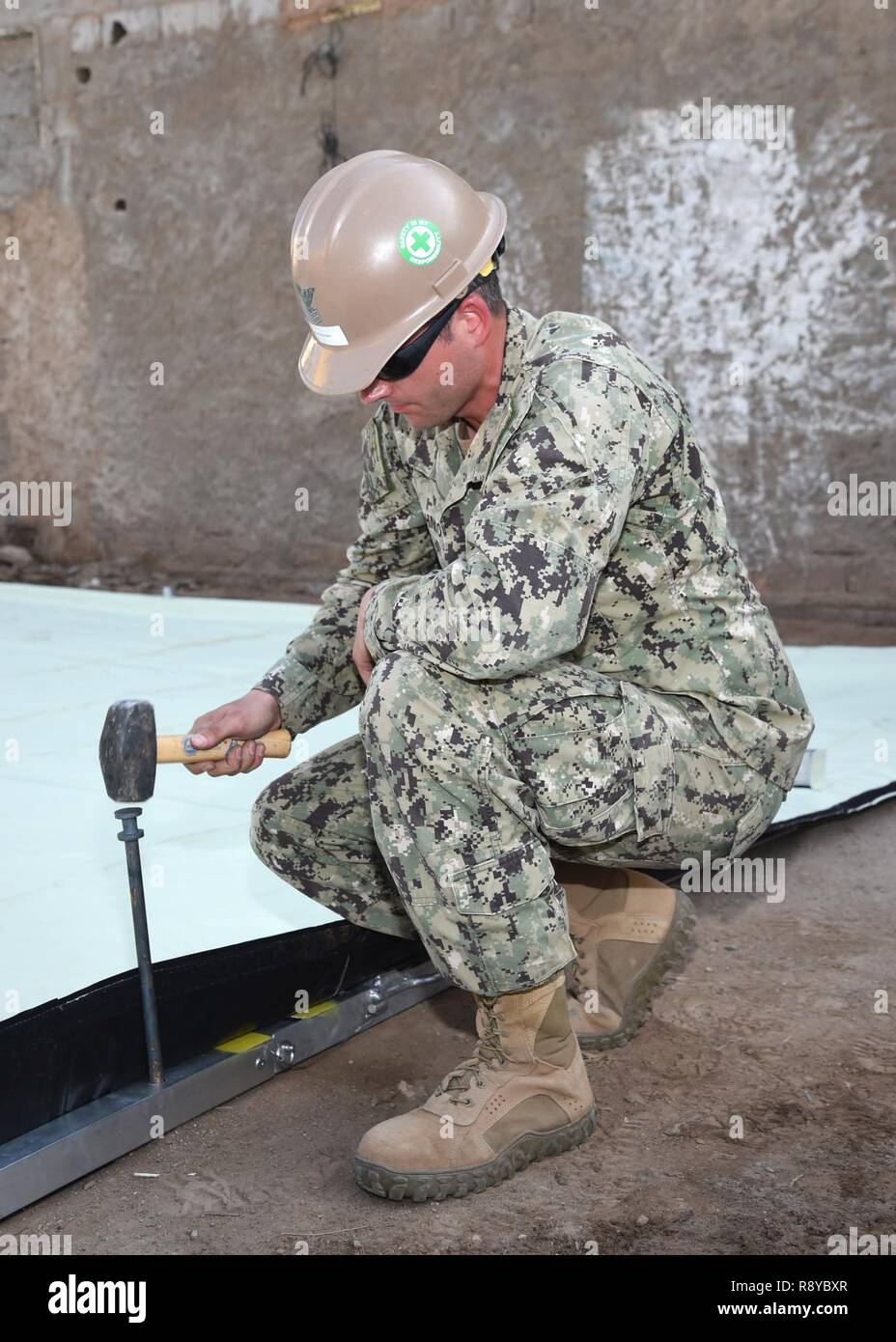 U.S. Navy Utilitiesman 1st Class Cole Johnson, a Seabee with Naval ...