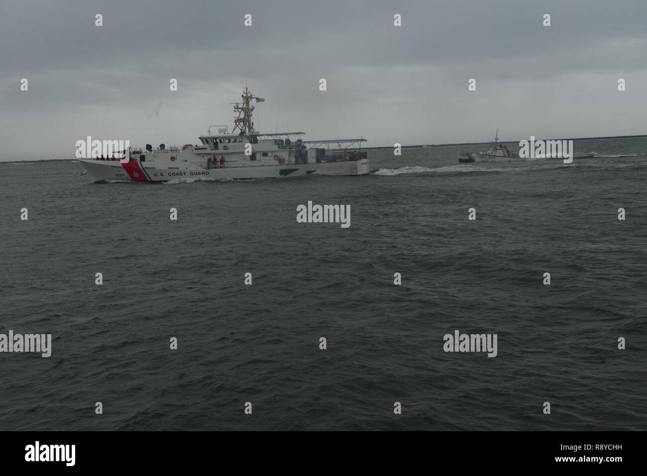 The Coast Guard Cutter John F. McCormick transits up the Columbia River ...