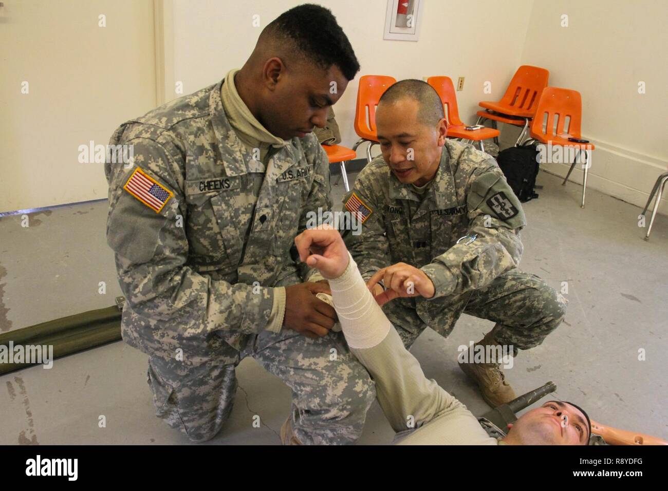 FORT MCCOY, Wis. - U.S. Army Reserve Capt. James Wong (right), nurse ...