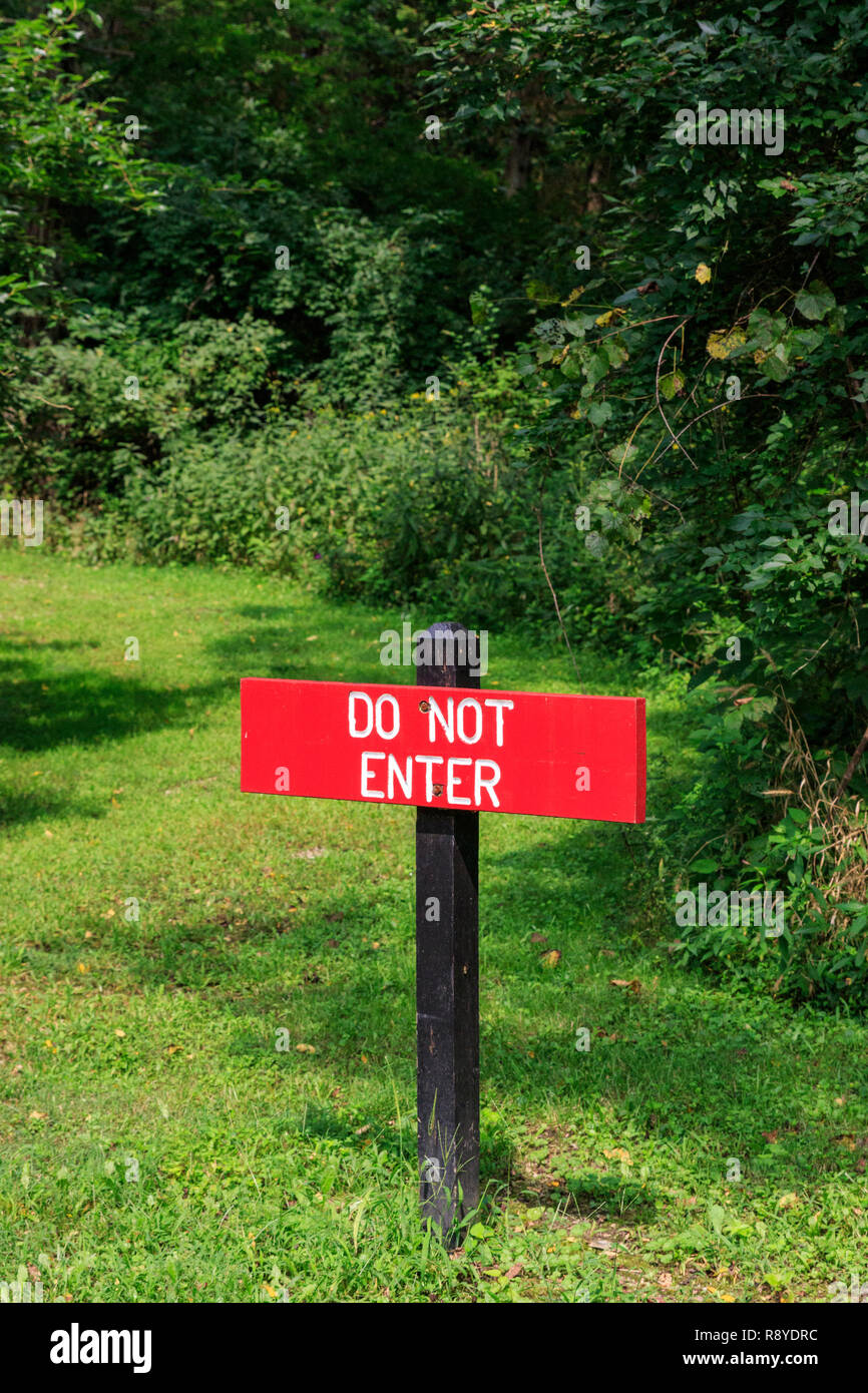 Do not enter sign along a forest path Stock Photo - Alamy