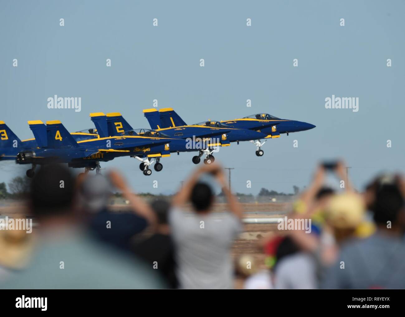 Spectators watch as the U.S. Navy Blue Angels take off during the 2017 ...