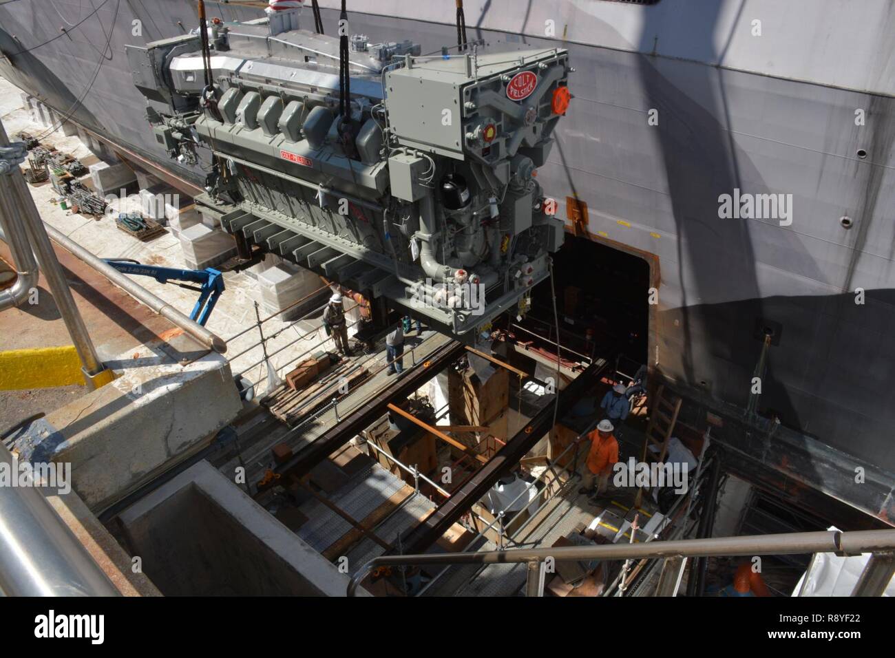 The replacement engine for USS Freedom (LCS 1) is lowered onto the ...