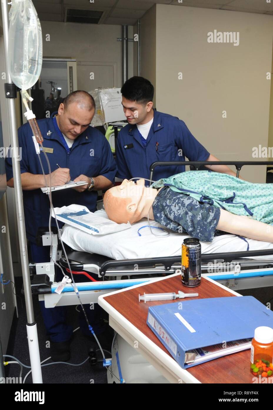 Hospital Corpsman 1ST Class Aurelio Lares and Hospitalman Pocholo Todor ...