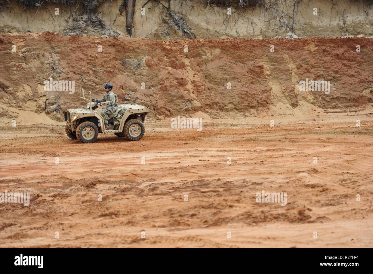 A Soldier with the 1st Battalion, 10th Special Forces Group, rides an ...
