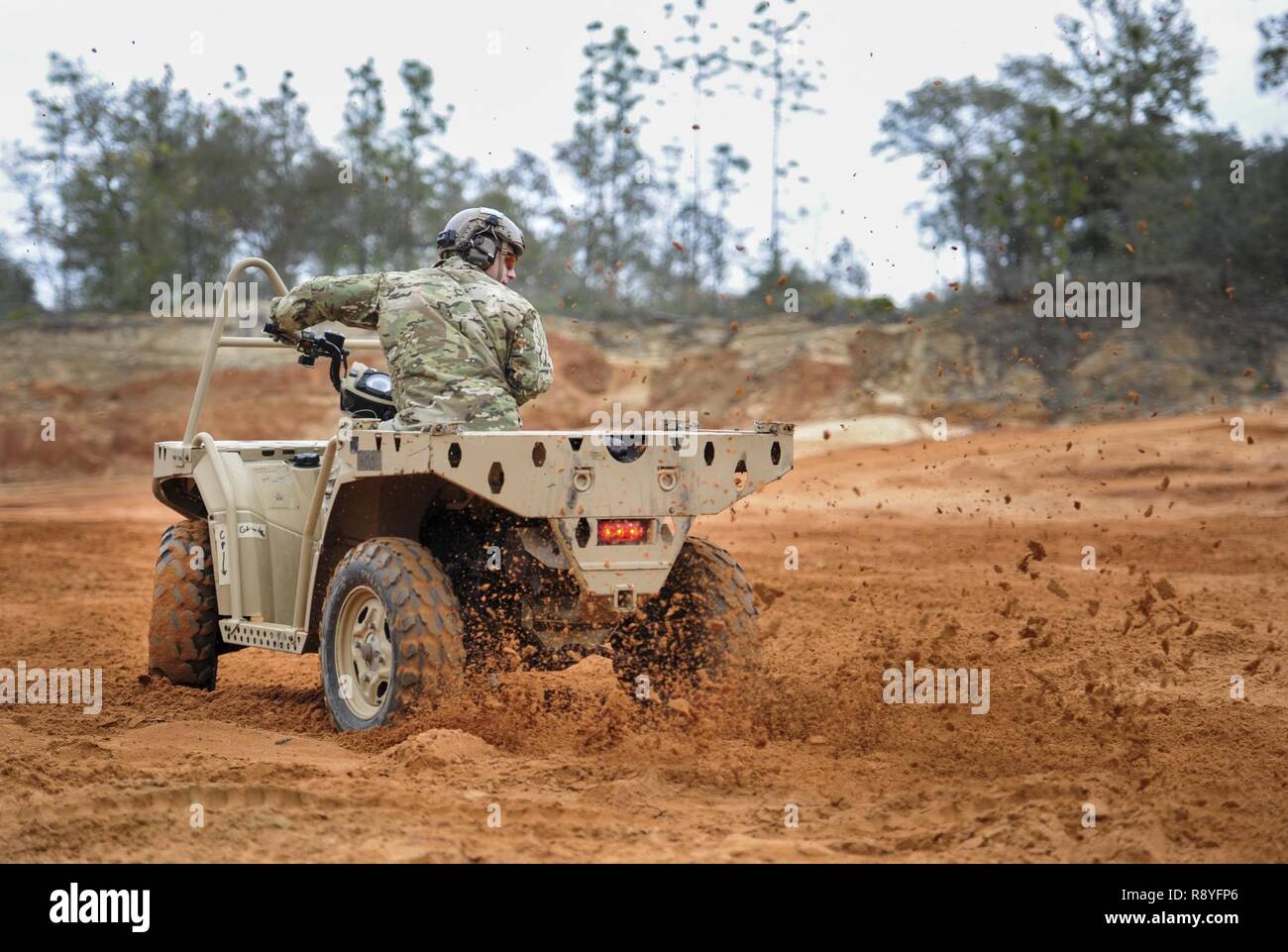 A Soldier with the 1st Battalion, 10th Special Forces Group, rides an ...