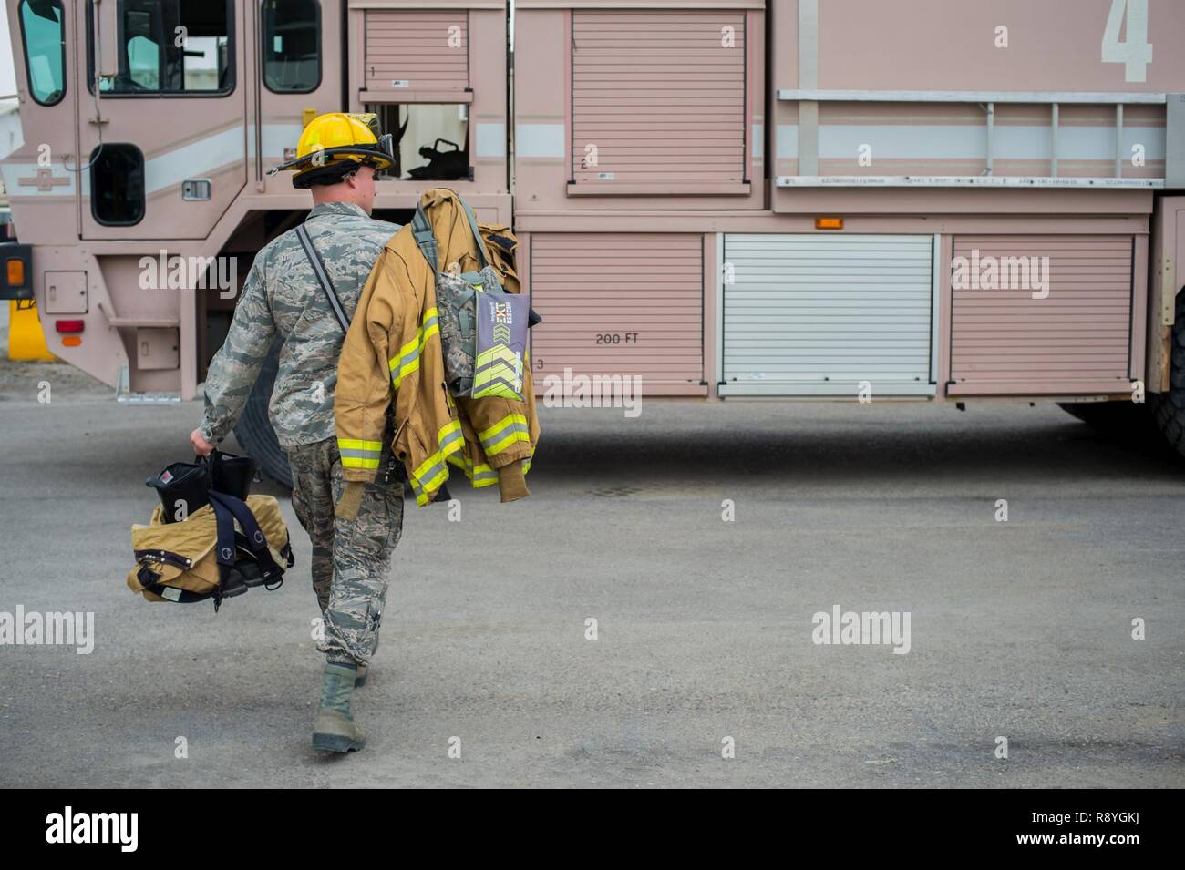 A 380th Expeditionary Civil Engineer Squadron firefighter prepares for ...