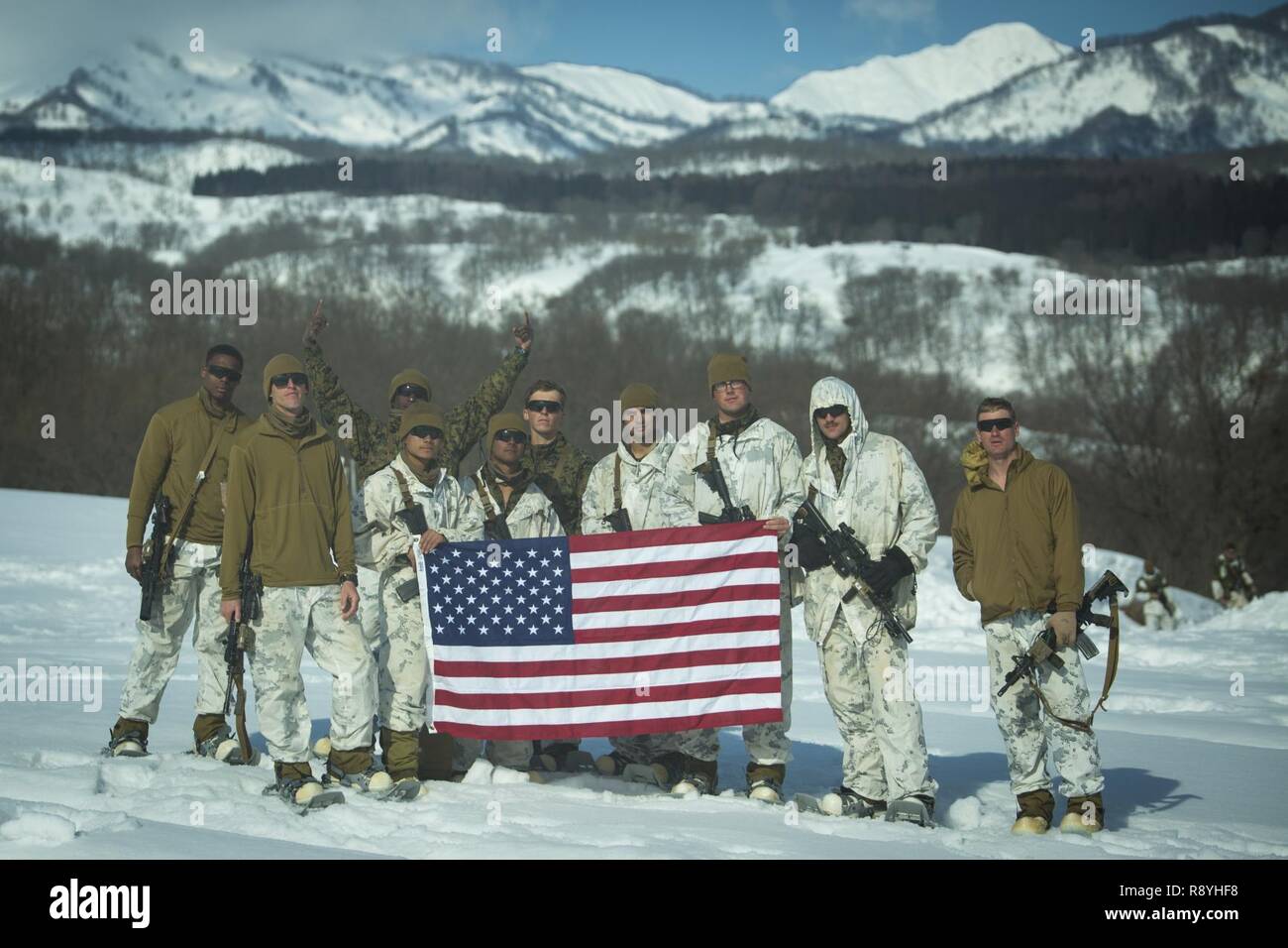 U.S. Marines carry their flag before the last movement of the exercise ...