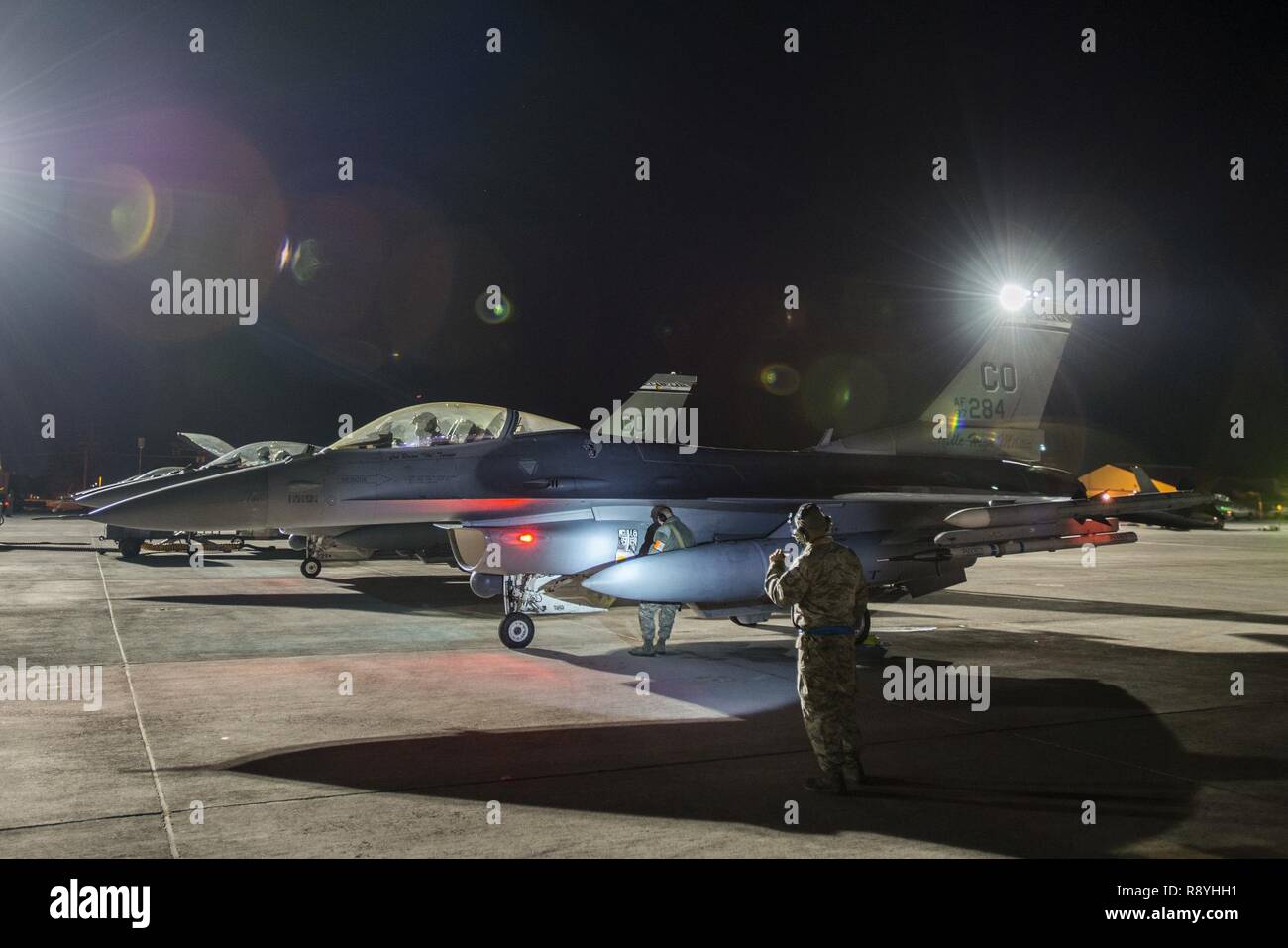 Tech. Sgt. James Grevious, a crew chief (foreground) and Senior Airman ...