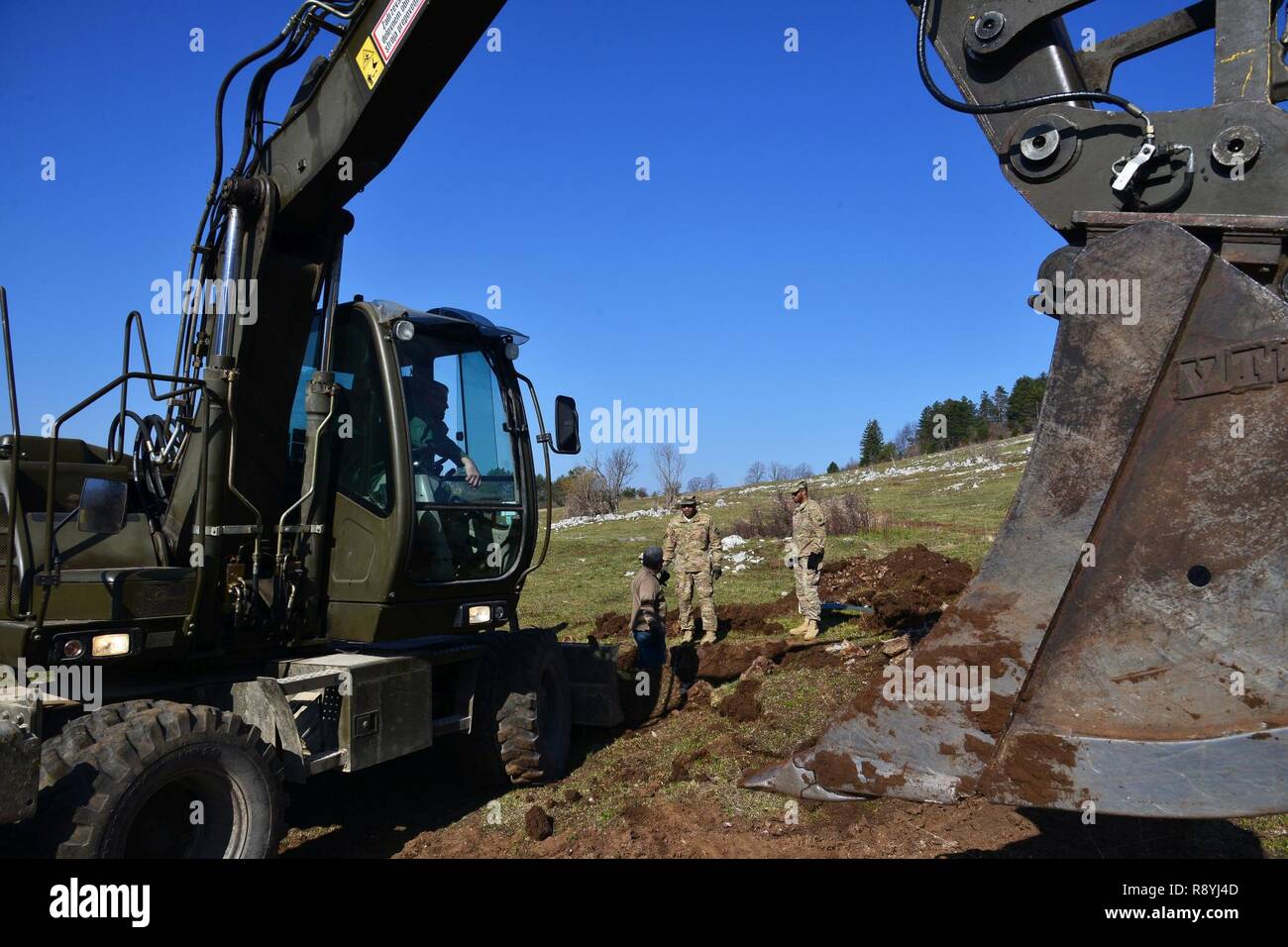 U.S. Army soldiers assigned to the 16th Sustainment Brigade, guide a ...