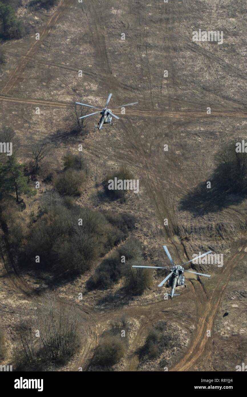 Two helicopters fly in formation hi-res stock photography and images ...