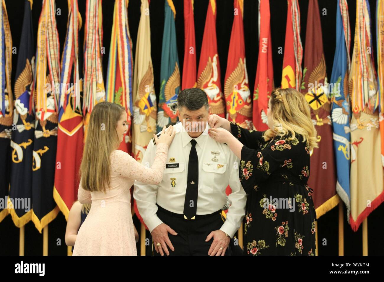 Col. Paul "Trey" B. Chauncey III lets his daughters put the new rank of ...