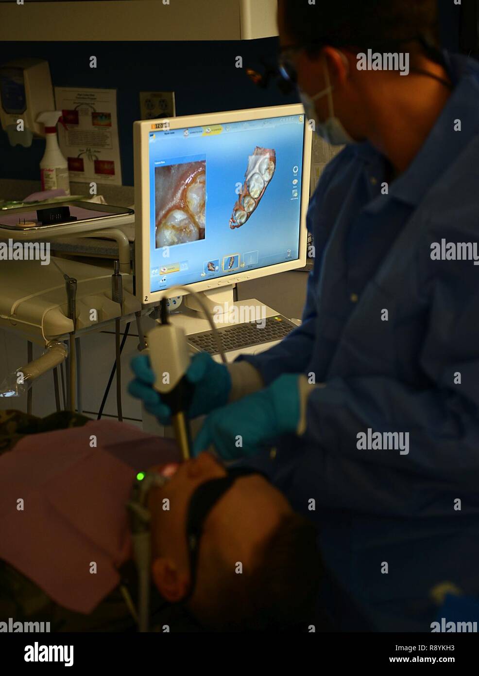 U.S. Army Capt. Tyler Oatmen, U.S. Army Dental Command dentist, takes ...