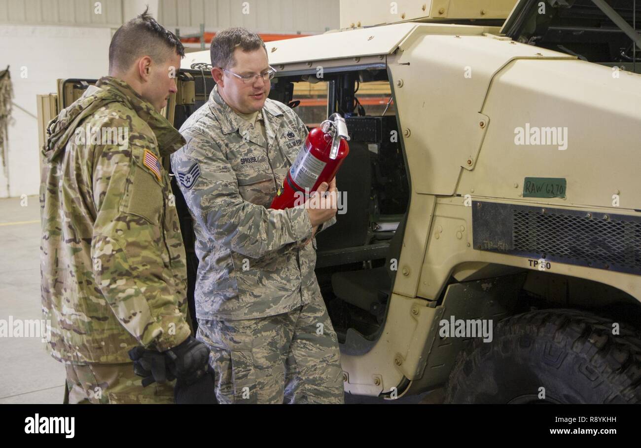 From left, Army Reserve Sgt. Maurizio F. Degrande, a military policeman ...