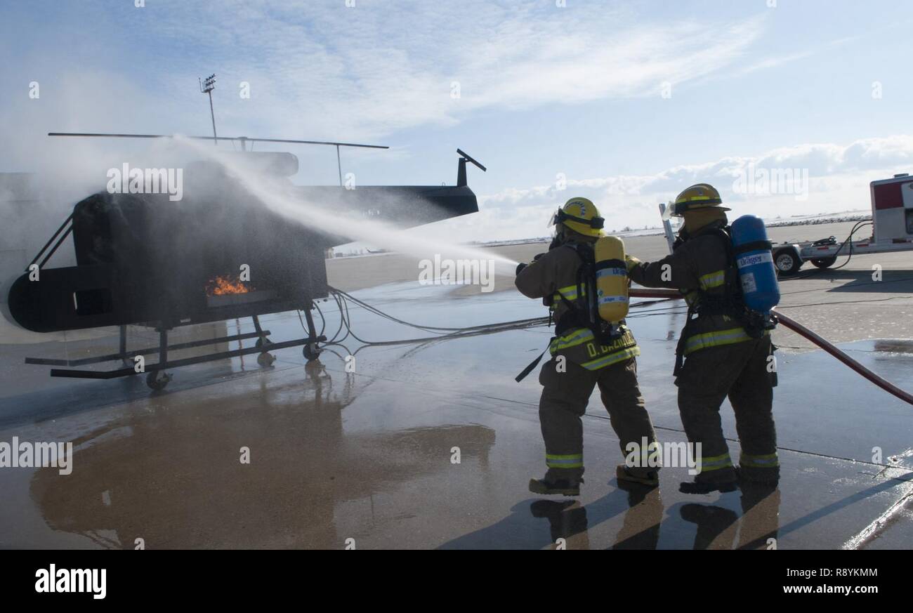 (From left) Dustin Bazille, Kenmare Fire Department firefighter, and ...