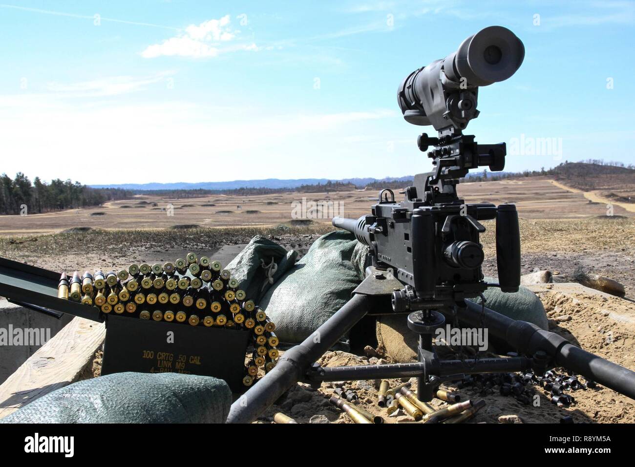 An M2 .50 caliber machine gun sits on the range after a gunner ...