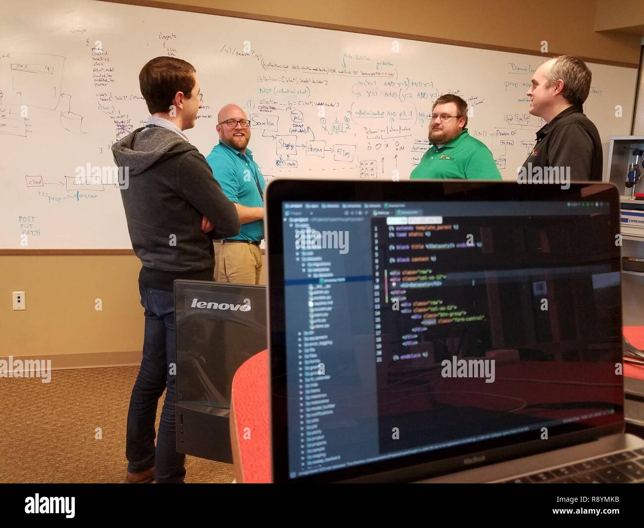 AFRL researcher Matt Jacobsen (second from left), developer of the ...