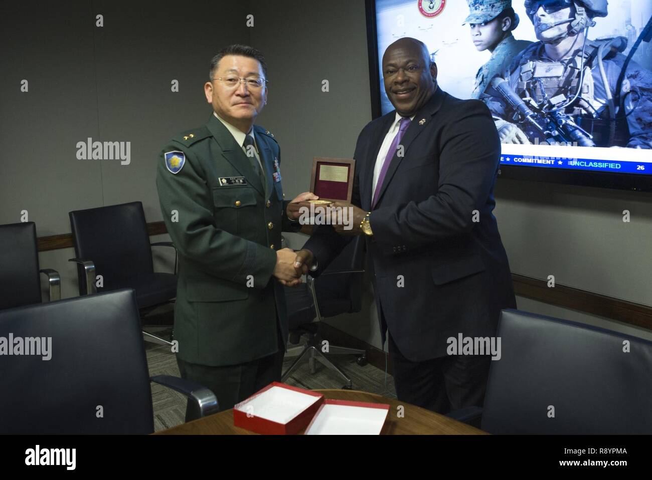 Japanese Self-Defense Force Maj. Gen. Hajime Kowase presents a gift to ...