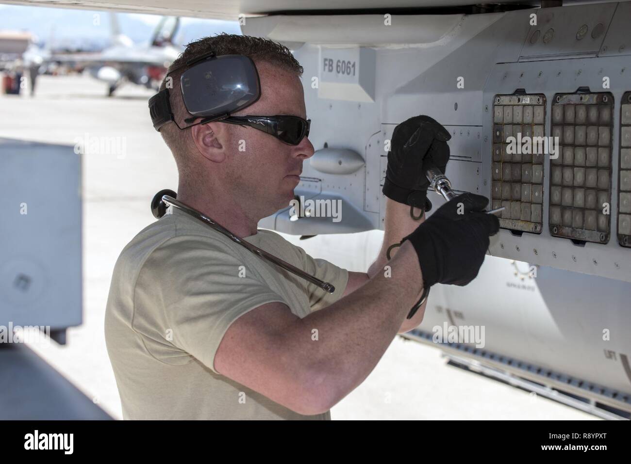 Senior Airman Kevin Isaac, aircraft armament systems specialist, loads ...