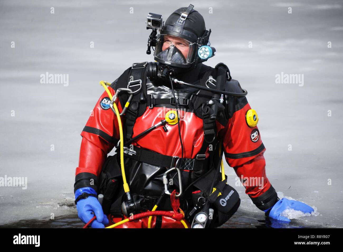 A member of the Fort McCoy Fire Department dive team conducts scuba ...