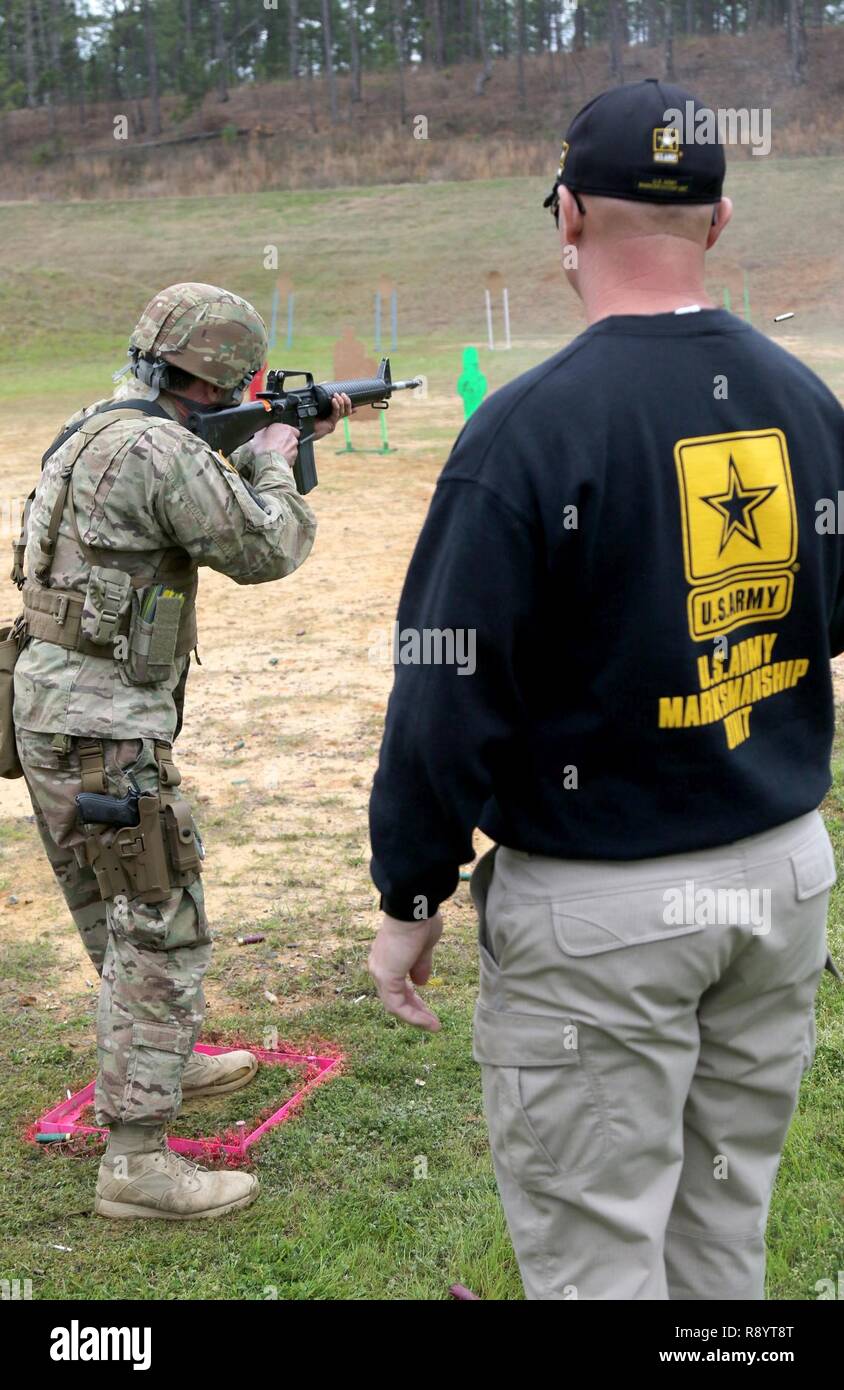A Soldier with the Army Marksmanship Unit times and supervises a ...