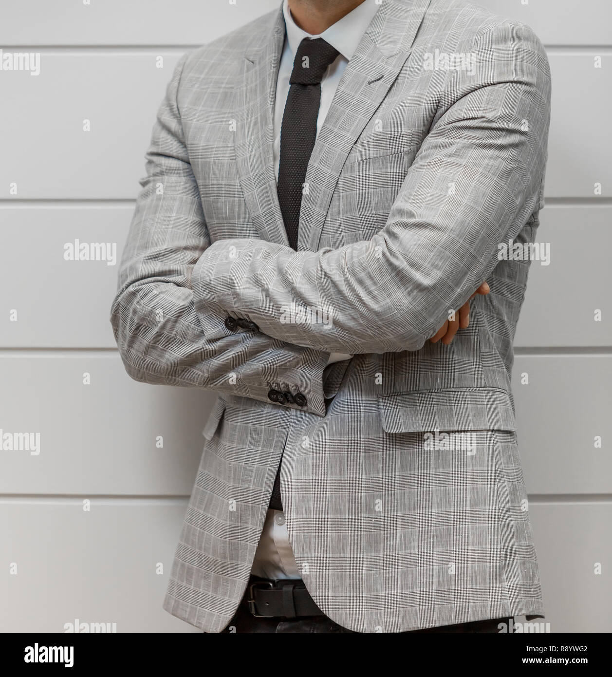 Close-up cropped Caucasian hands and arms of businessman in a suit with ...