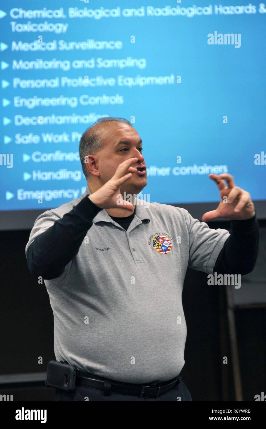 Instructor Michael Mennella reviewing the previous instructions with ...