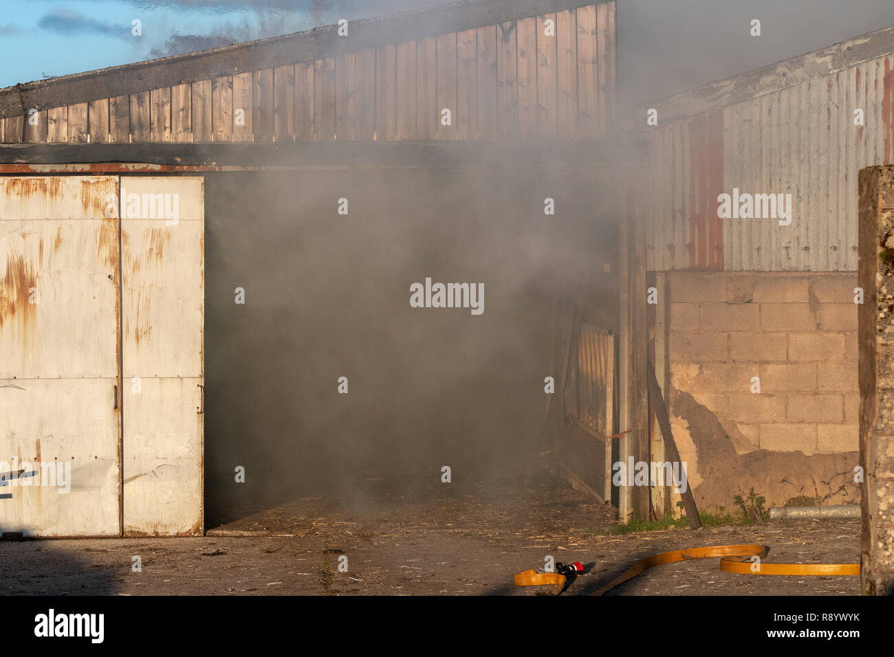 Barn fire being attended to by Fire Crew. Cumbria, UK Stock Photo - Alamy