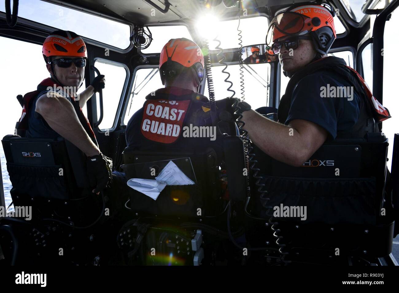Members of a boarding team aboard the Coast Guard Cutter Stratton ...