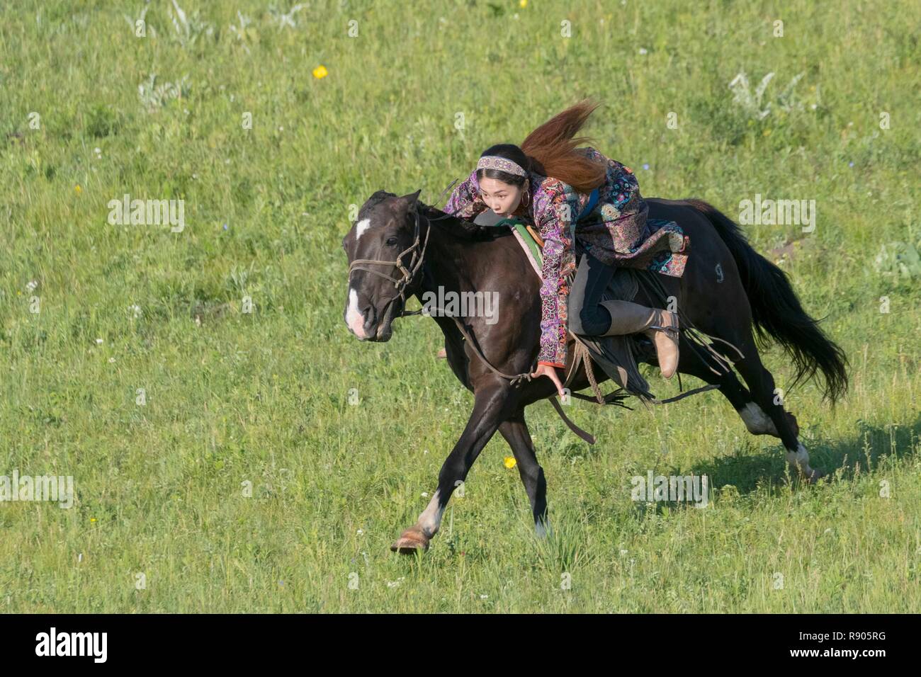 Mongolian woman on horseback hi-res stock photography and images - Alamy