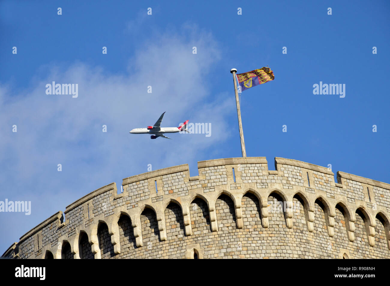 An aeroplane out of London Heathrow airport passes over the Keep of ...