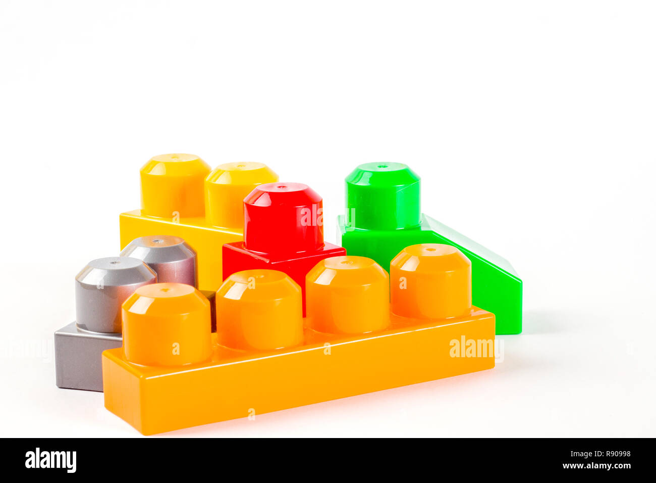 Coloured plastic building blocks isolated on white background Stock ...