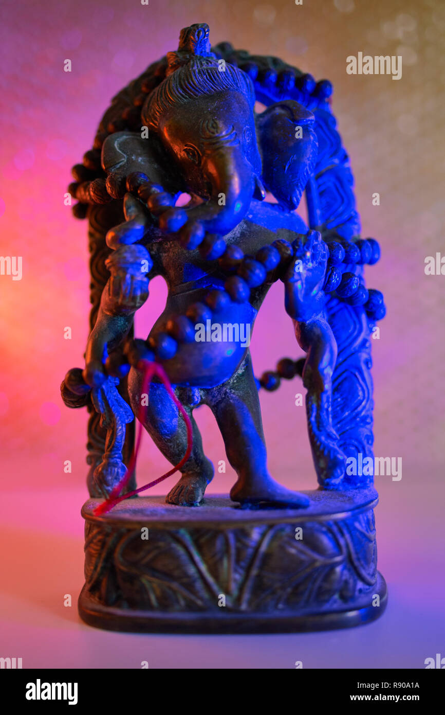 Hindu God - Lord Ganesha with rudraksha rosary in a colorful light ...
