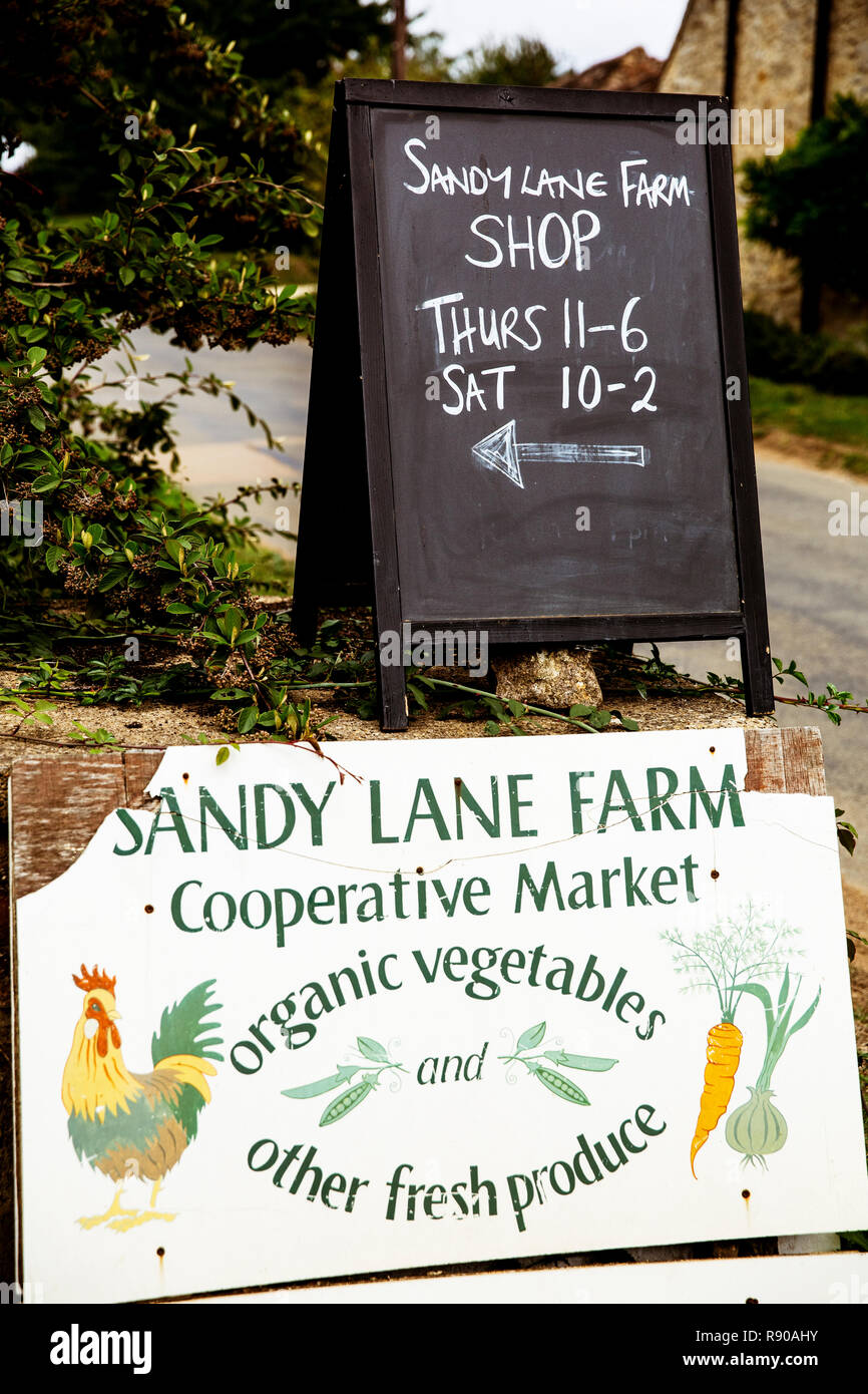 Close up of Sandy Lane farm shop sign and blackboard with opening times ...