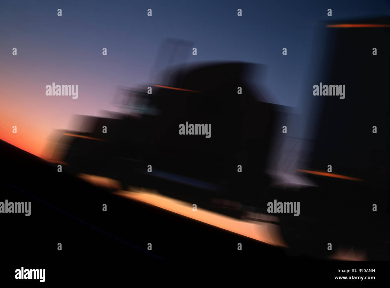 Peterbilt Class 8 sleeper truck shilouted and blurred at sunset Stock ...