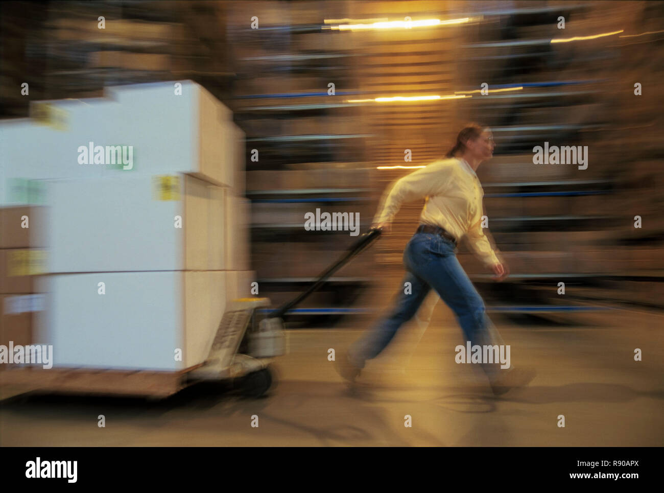 Warehouse pulling pallet truck boxes hi-res stock photography and ...