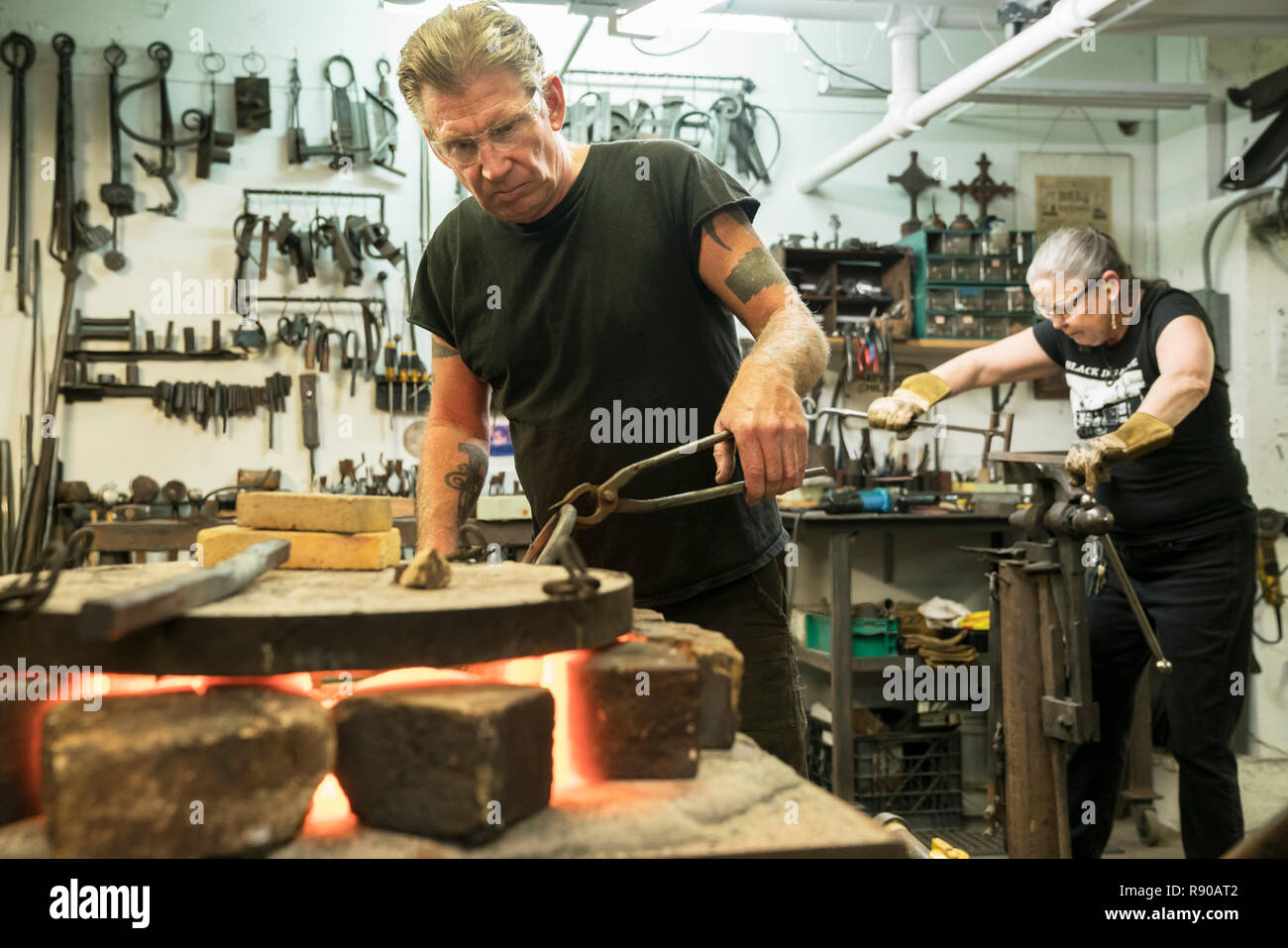 Woman blacksmith working in forge hi-res stock photography and images ...