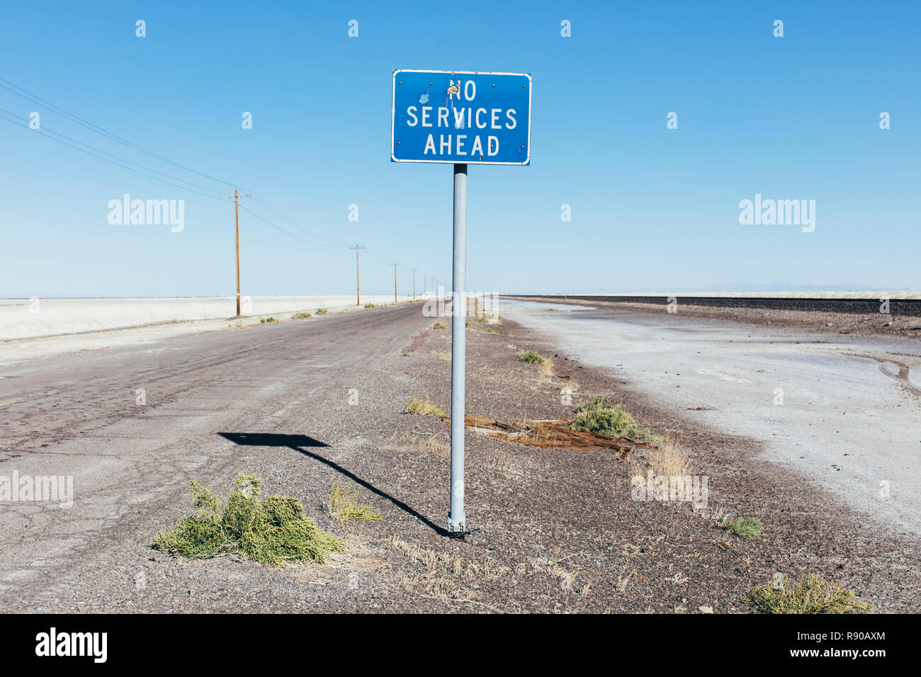 No Services Ahead sign along remote desert road Stock Photo - Alamy