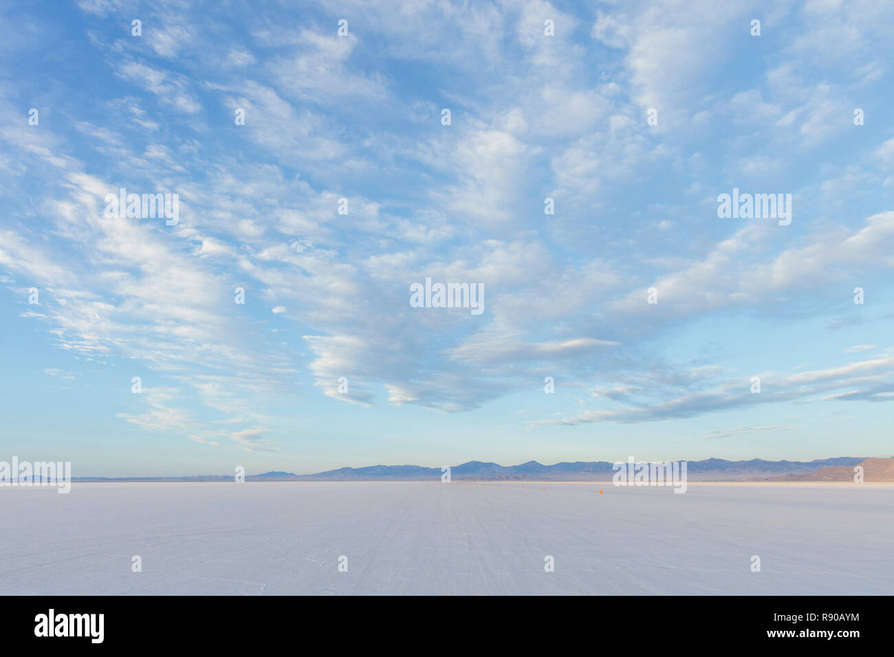 Salt flats at dawn under a cloudy sky Stock Photo - Alamy