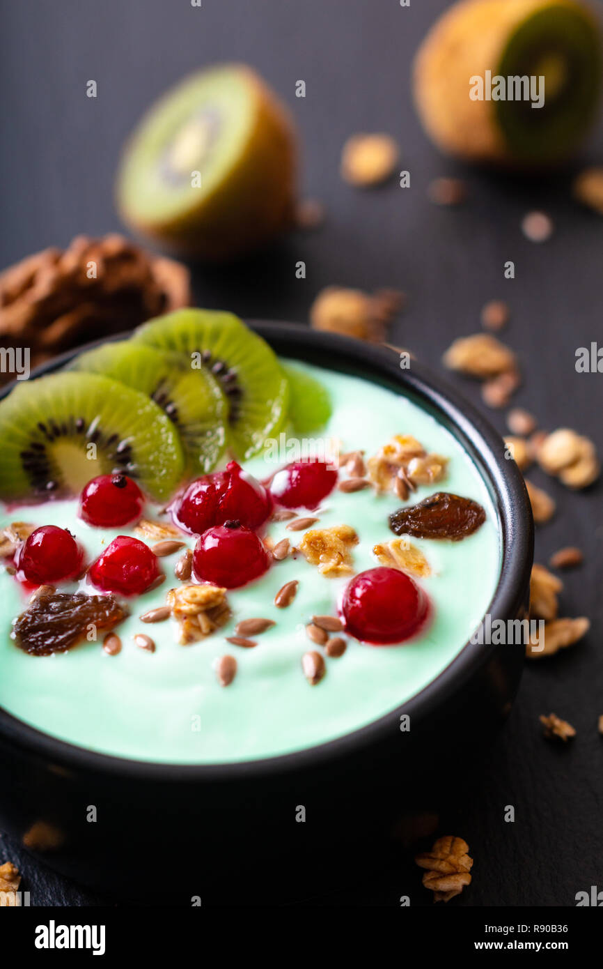 Healthy food colorful Yogurt Breakfast Bowl with kiwi, flax seeds ...
