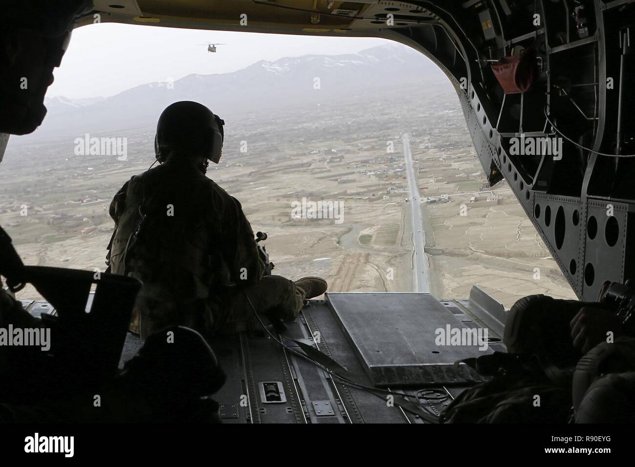 A CH-47 Chinook crew chief watches the city of Gardez, Afghanistan ...