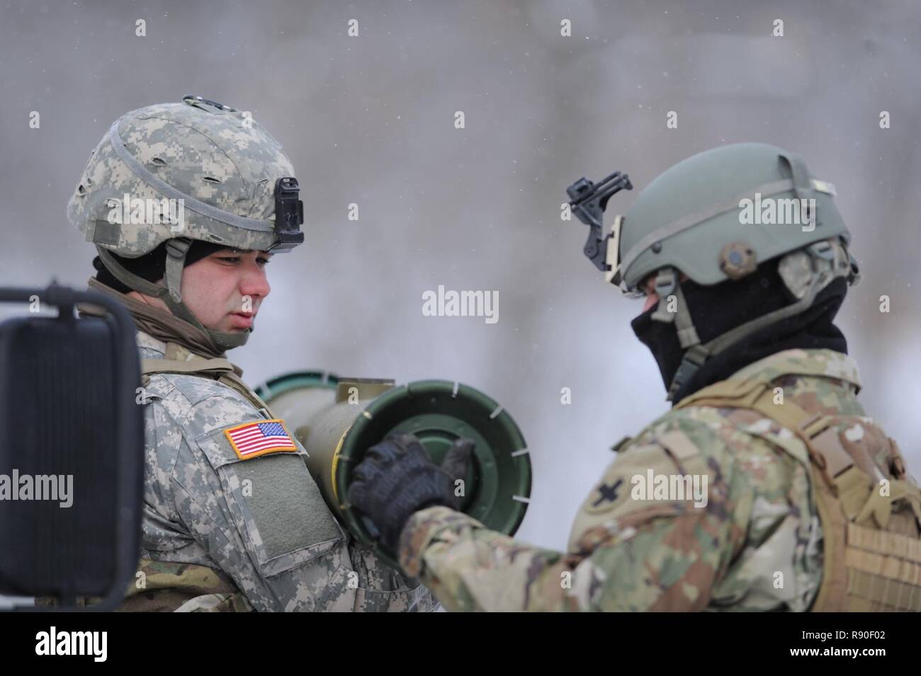 U.S. Army specialists Mike McGuire and Alfonso Rodriquez (right) with ...