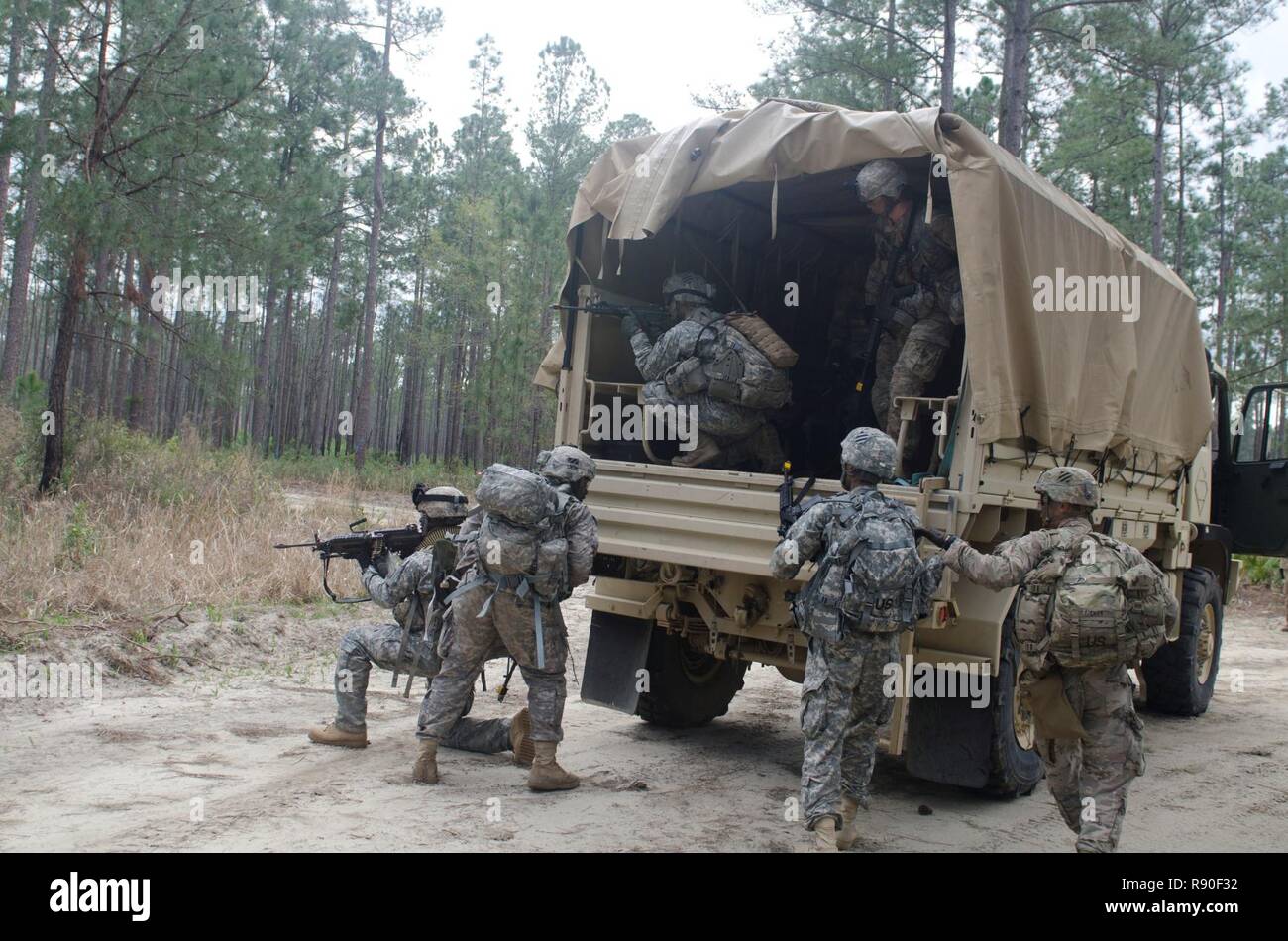 Soldiers attending the Marne Leader Development Course, work on vehicle ...
